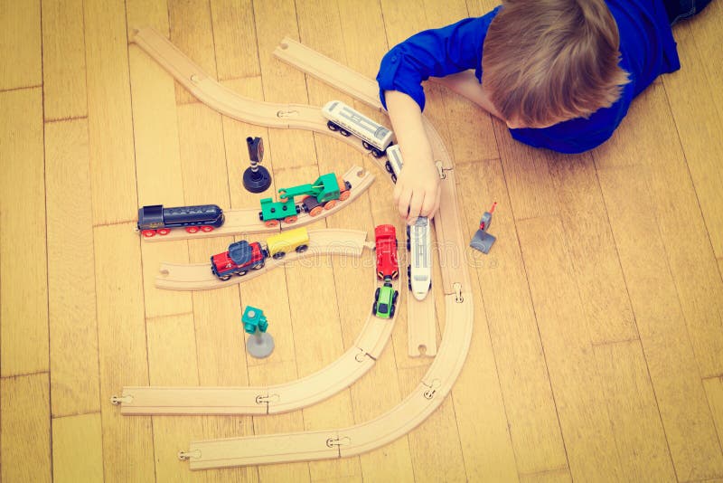 Child Playing with Trains Indoor Stock Image - Image of leisure, game ...