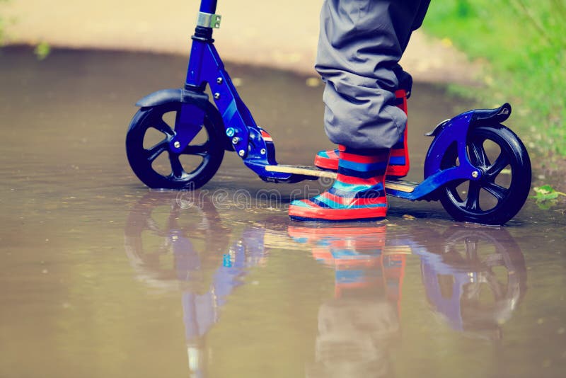 Child Playing in Water Puddle, Kids Outdoor Stock Image - Image of ...