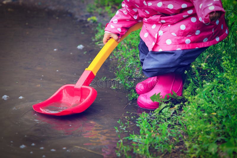 Child Playing in Water Puddle, Kids Outdoor Stock Photo - Image of ...
