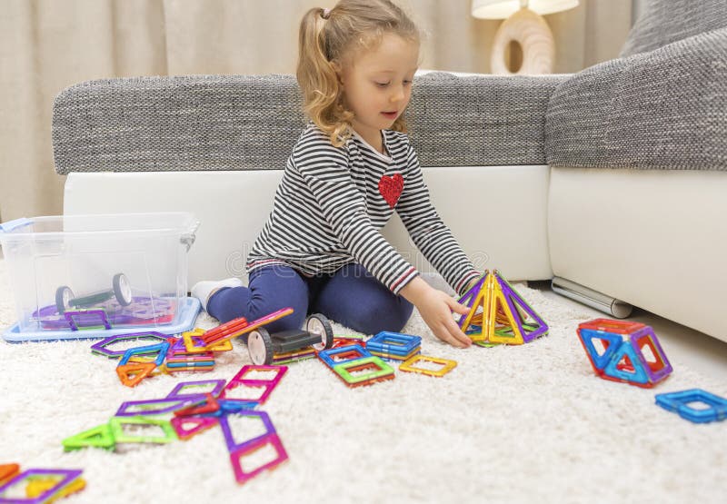Child Plays with a Magnetic Construction Set. Stock Photo - Image of ...