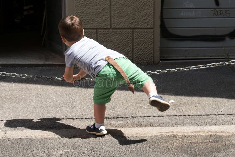 Child plays with a chain stock image. Image of little - 96423639
