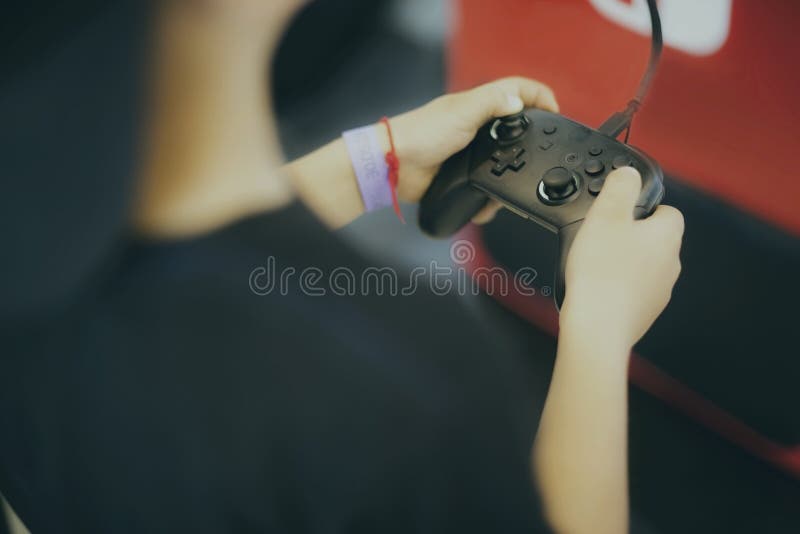 Playing with the Joystick in the Hands Stock Photo - Image of education ...
