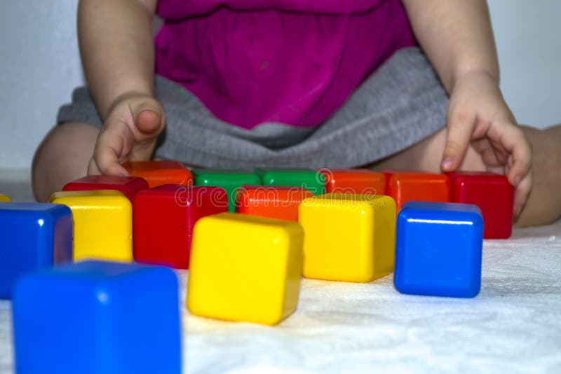 The Child Plays in Cubes, the Development of the Child. Stock Image ...