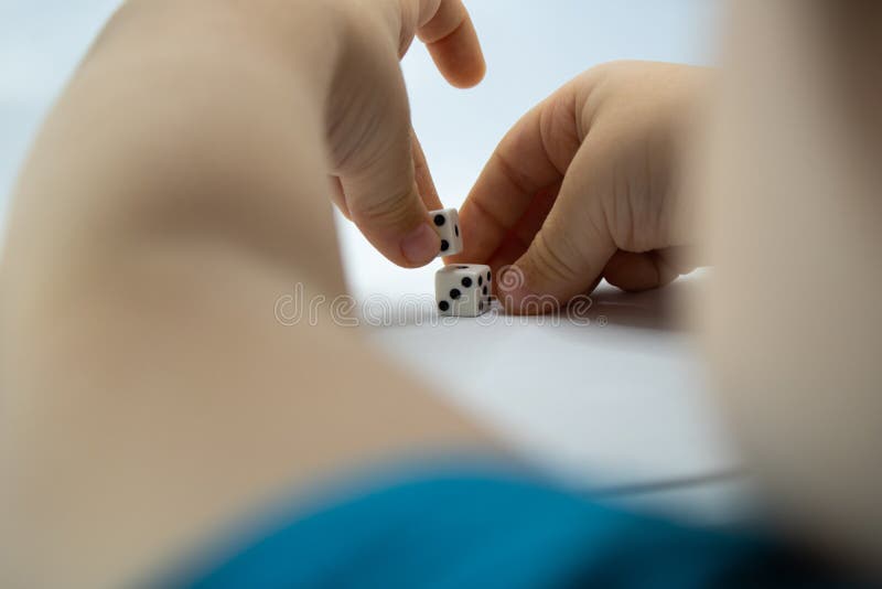 The Child Plays Dice. Children`s Hands Hold Cubes Stock Photo - Image ...