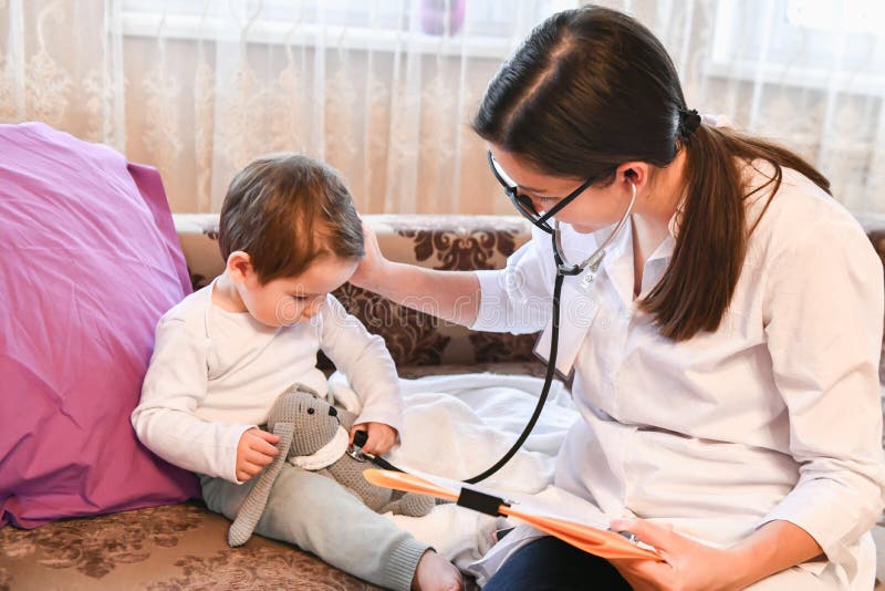 Child Plays Doctor with a Doctor. Family Doctor Stock Photo - Image of ...