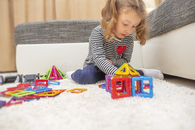 Child Plays with a Magnetic Construction Set. Stock Image - Image of plastic, creative: 268623911