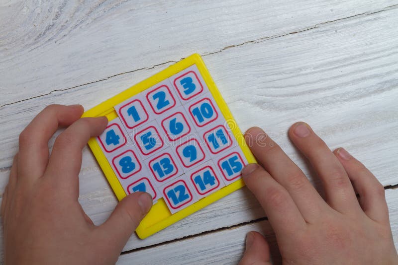 The Child Plays a Math Game with Numbers Tag, Puts the Numbers in the ...