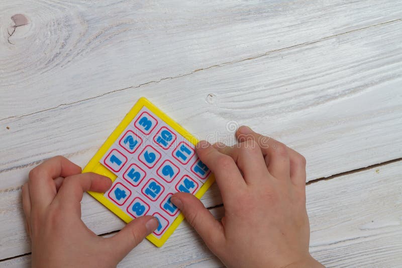 The Child Plays a Math Game with Numbers Tag, Puts the Numbers in the ...