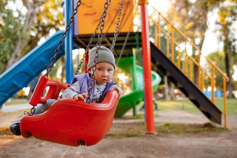 The Child Plays on the Playground. Stock Image - Image of colorful ...