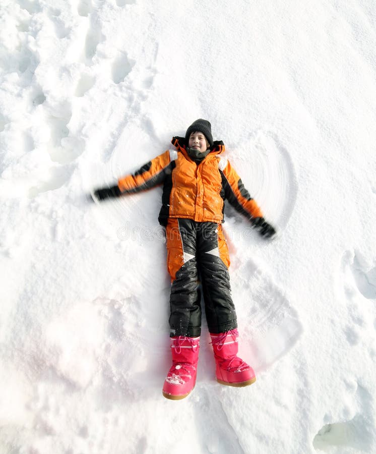 Child Plays in the Snow and he Makes the Shape of the Angel Stock Image ...