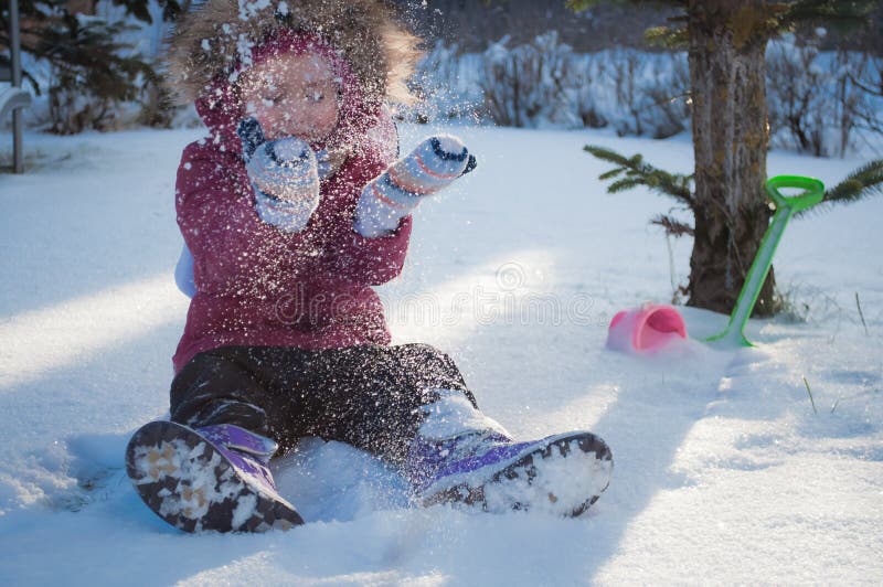 A child plays in the snow stock photo. Image of christmas - 36787724