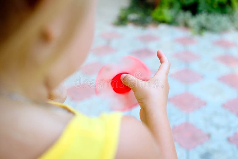 Child plays with spinners stock photo. Image of child - 101684164