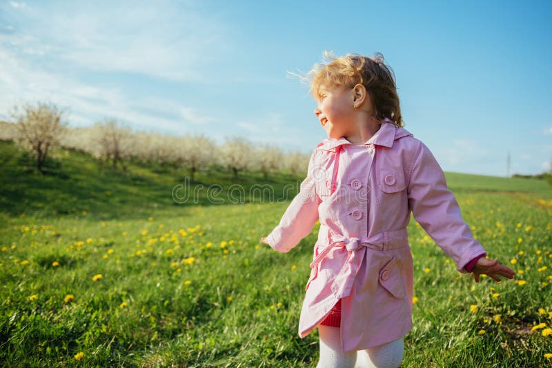 Child Plays on Spring Lawn. Stock Image - Image of caucasian, health ...