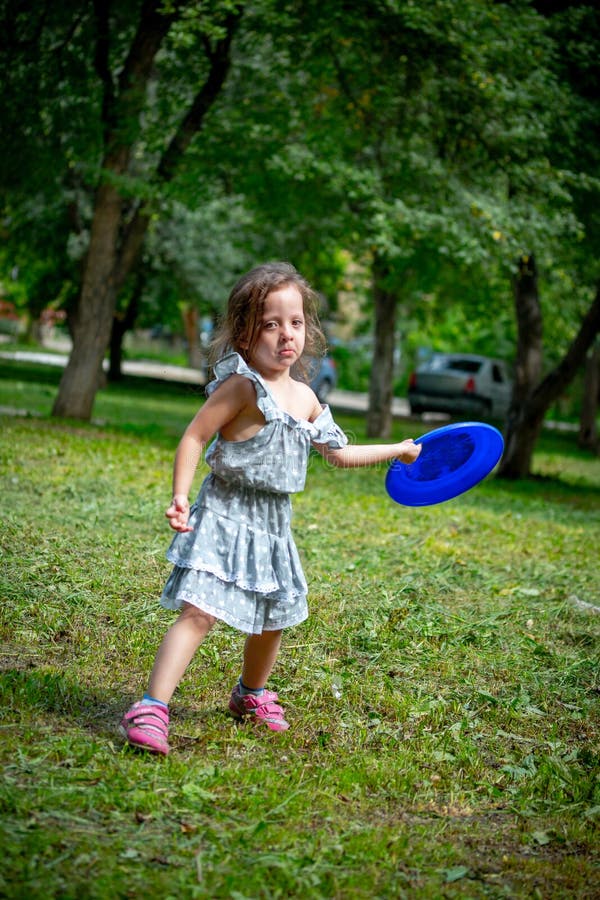 Child Plays Tossing a Flying Disc Stock Image - Image of person, nature ...