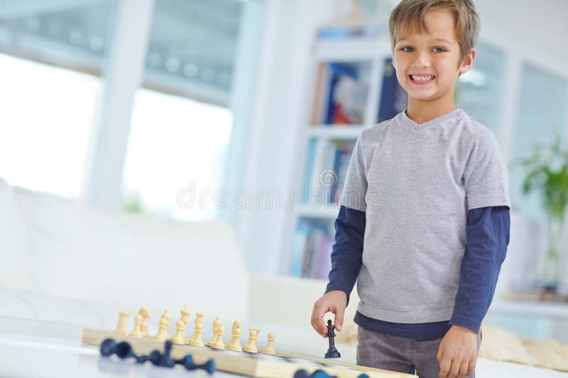 Child, Portrait and Playing Chess in Home for Learning, Development and ...