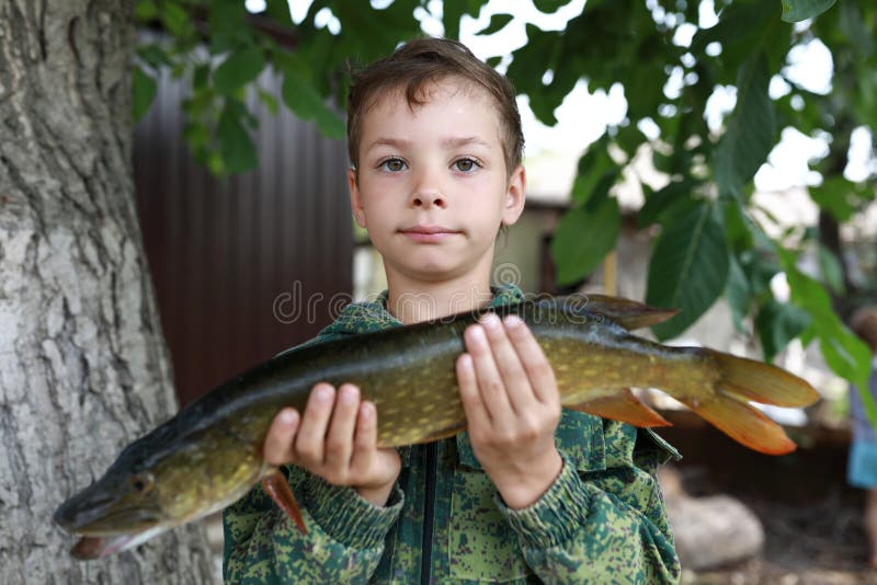 Child posing with pike stock image. Image of curiosity - 122637593