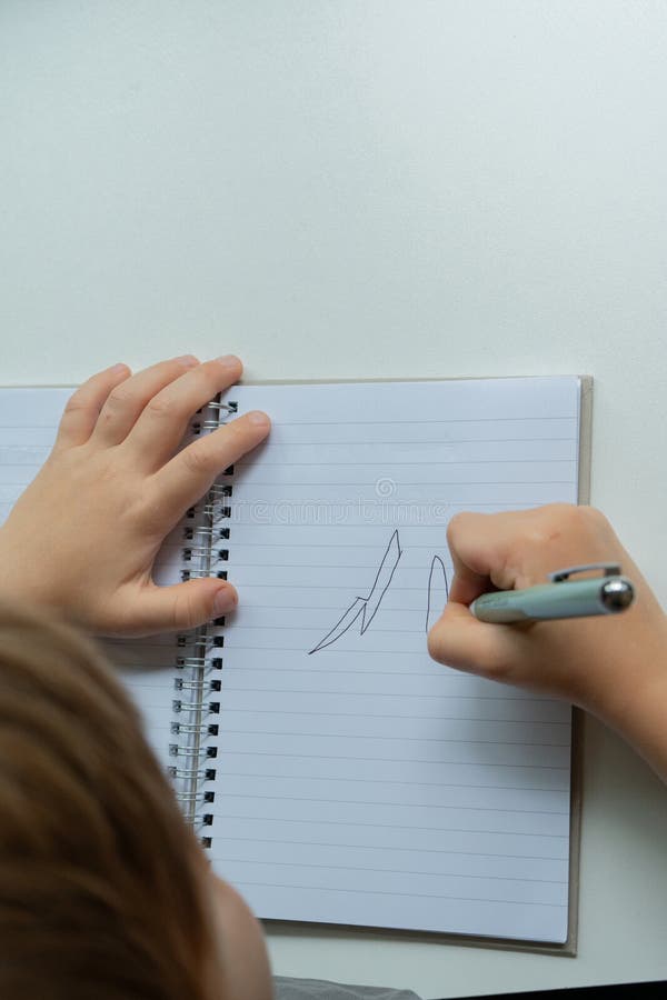 Child Practicing Handwriting in Notebook - Close-up Educational Series ...