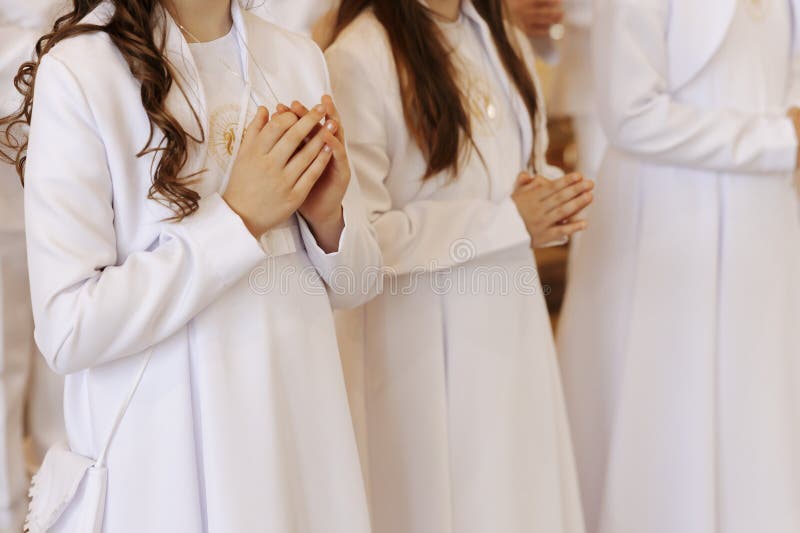 Child Praying with Folded Hands during First Holy Communion Ceremony ...