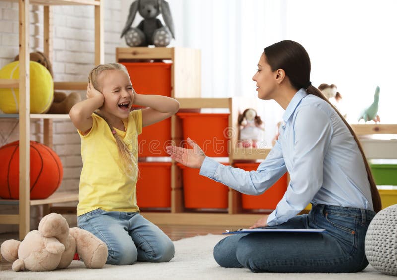 Child Psychotherapist Having Conversation with Little Girl Stock Photo ... Child Psychotherapist Having Conversation with Little Girl Stock Photo ...