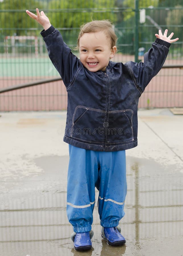 Child in puddle stock image. Image of splash, enjoyment - 30796917