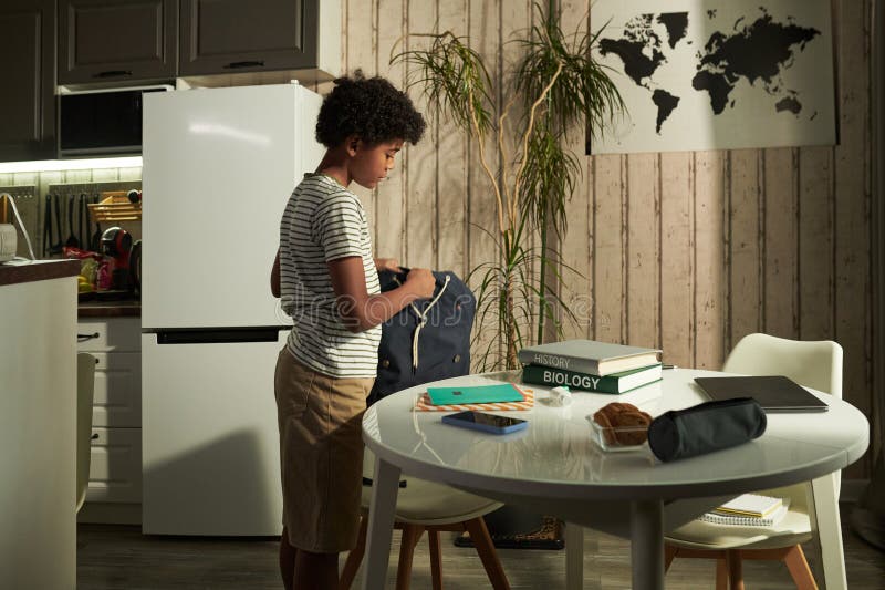 Child Putting School Items Backpack Stock Photos - Free & Royalty-Free ...