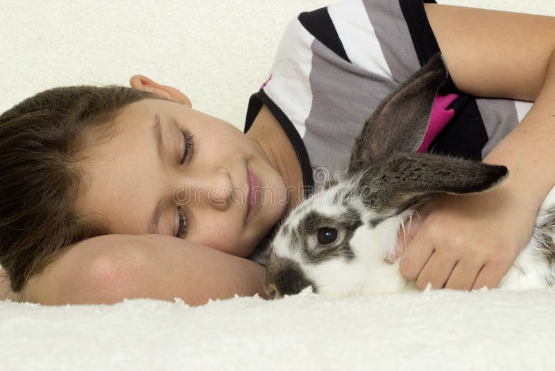 Child and rabbit stock photo. Image of embracing, beautiful - 48309452