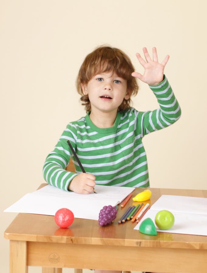 Child Raising Hand in School Stock Photo - Image of sitting, school ...