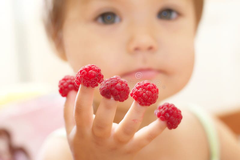 Child with Raspberry on Fingers, Focus on Hands Stock Image - Image of ...