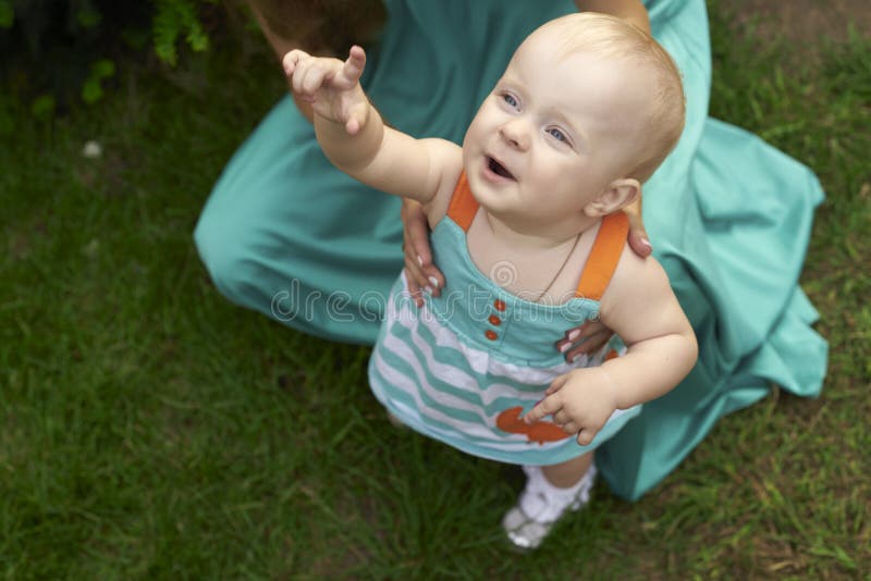 Child reaches his hand up stock image. Image of blonde - 87860341