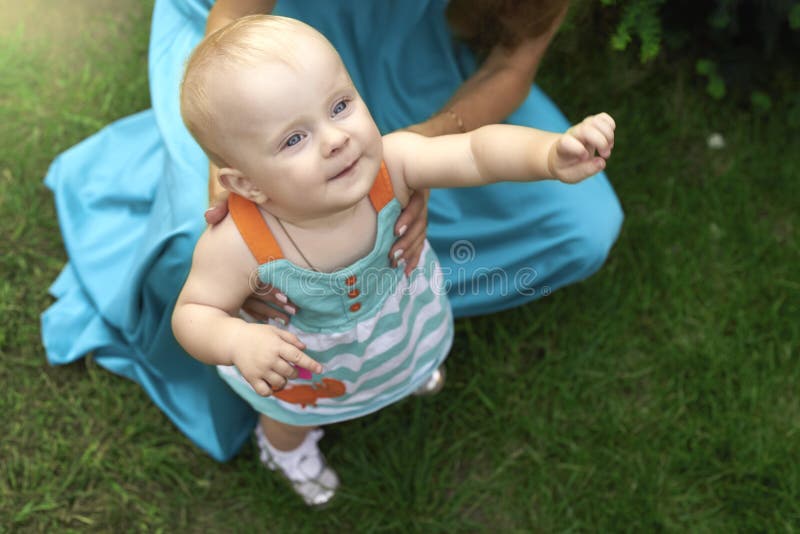 Child reaches his hand up stock image. Image of turquoise - 89568919