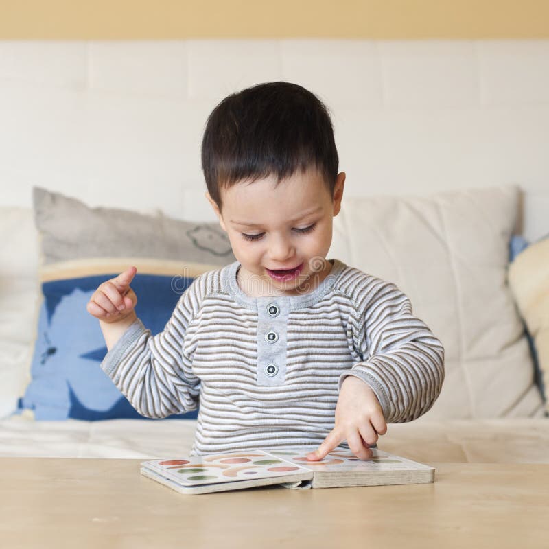 Little boy reading stock image. Image of seated, sweet - 521531