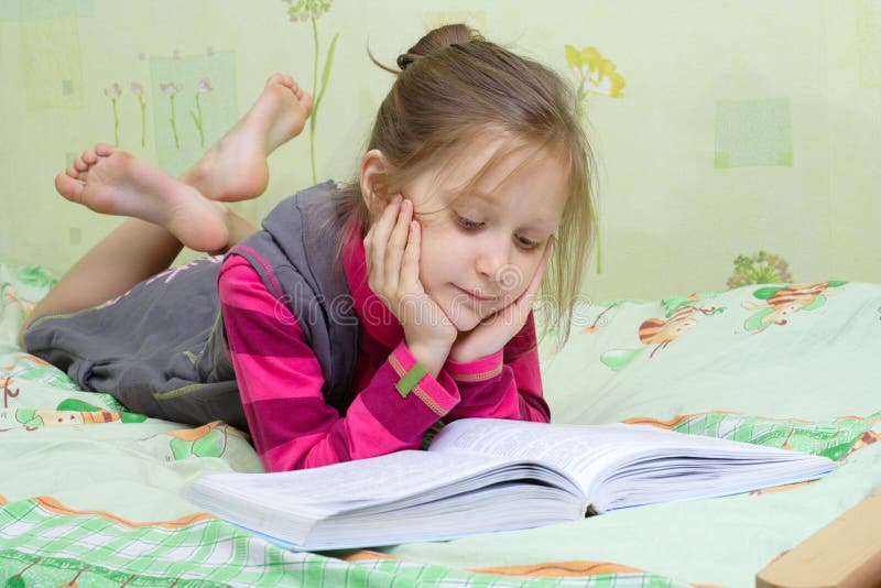 Child reading a book stock image. Image of intent, clever - 8729897