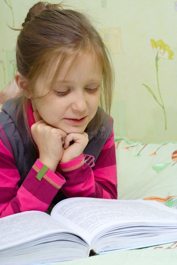 Child reading a book stock image. Image of leisure, reading - 12450893