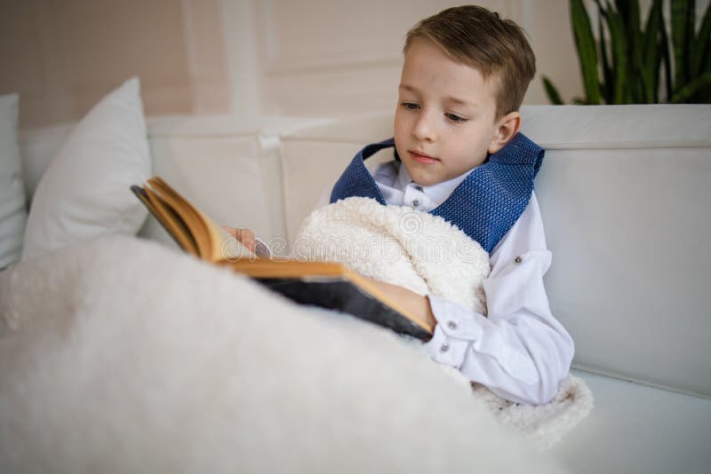 Child Reading Book in Bed. Kids Read in Bedroom. Stock Photo - Image of ...