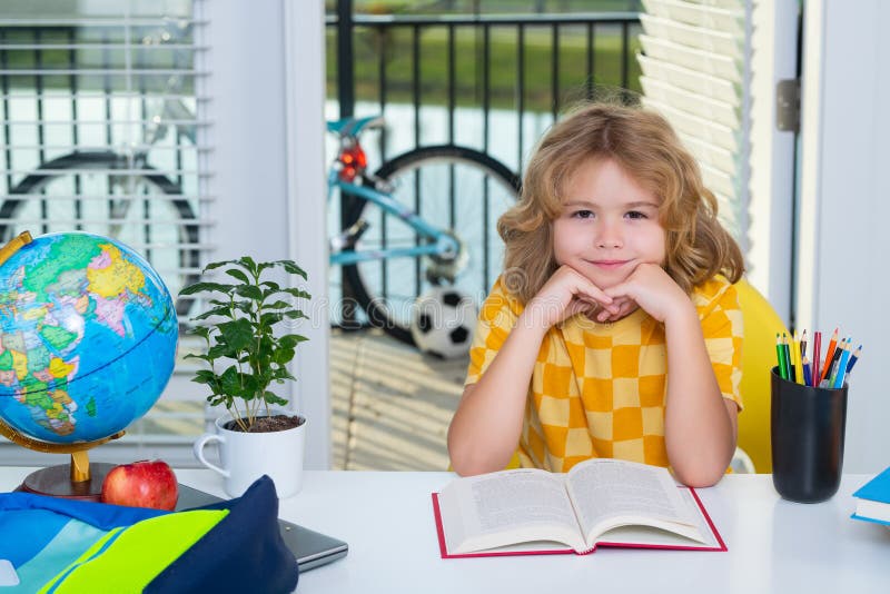 Child Reading Book. School Child Studying in Classroom at Elementary ...