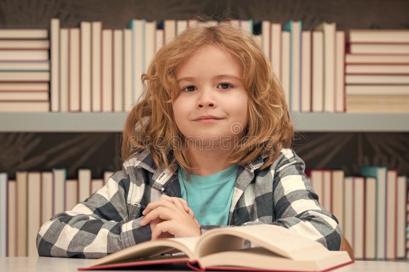 Child Reading a Red Book in the Library. Little Student on School ...