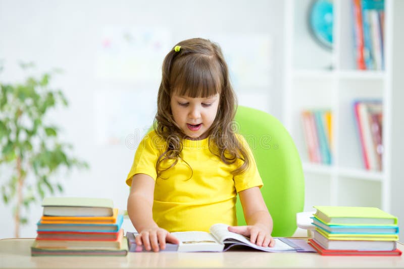 Child Reading a Red Book in the Library Stock Photo - Image of primary ...