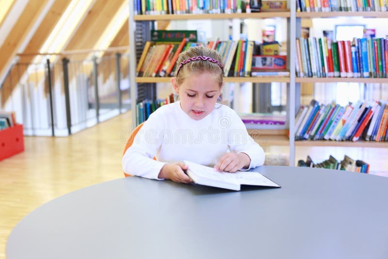 Child reading in library stock photo. Image of children - 20050528