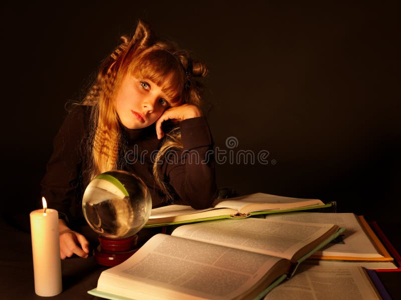 Child Reading Magic Book at Candle. Stock Image - Image of candle, ball ...