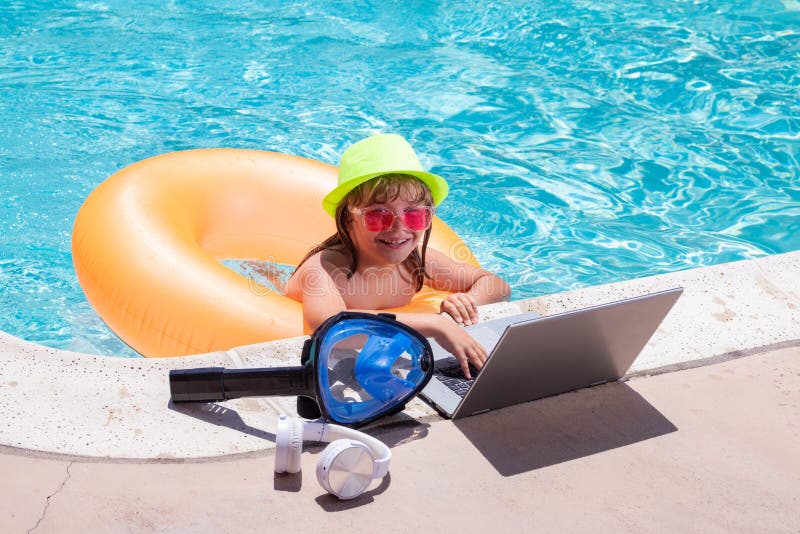 Child Relaxing in the Pool, Using Laptop Computer in Summer Water. Kid ...