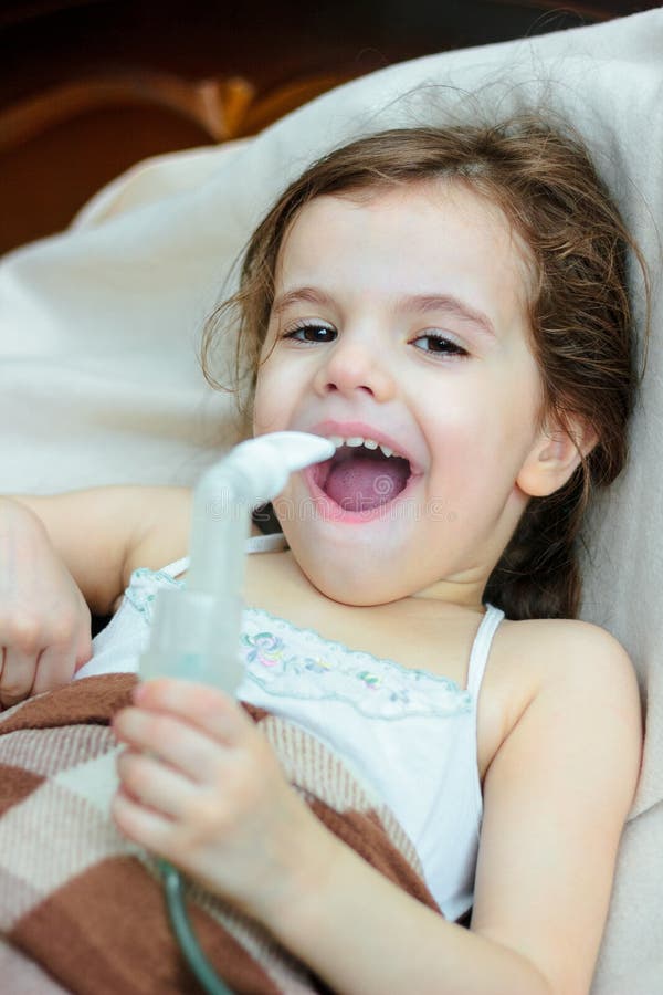 Child with Respiratory Illness Making Inhalation with Inhaler. Stock ...