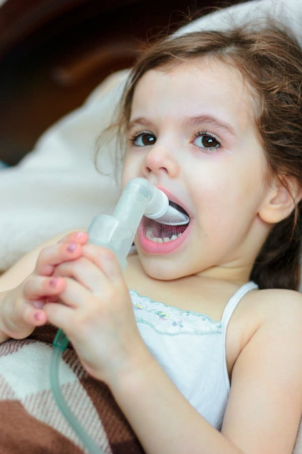 Child with Respiratory Illness Making Inhalation with Inhaler. Stock ...