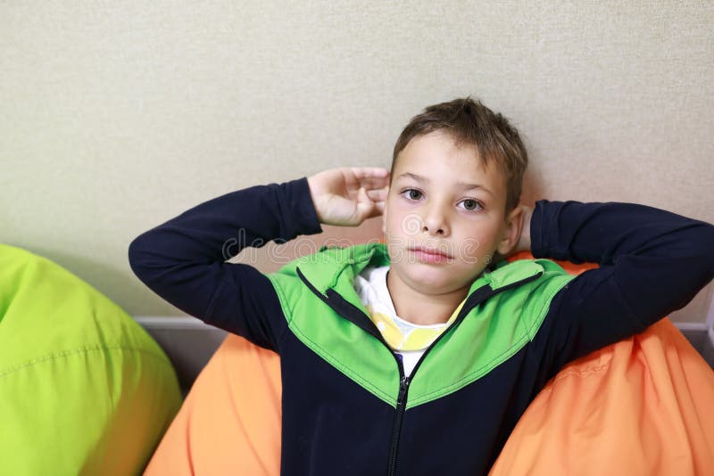 Child Resting on Bean Bag Chair Stock Image - Image of cozy, calm ...