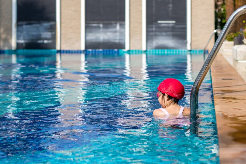 Child Resting at Edge of Swimming Pool after Swimming Training Stock ...