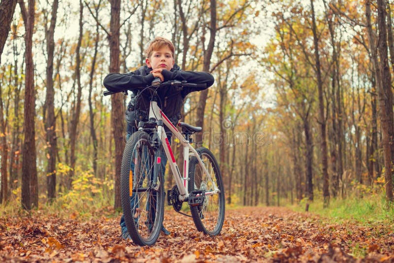 Child resting on his bike stock image. Image of leisure - 87723965