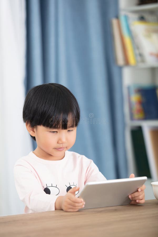 Child Resting after a Meal Watching Tablet Stock Photo - Image of ipad ...