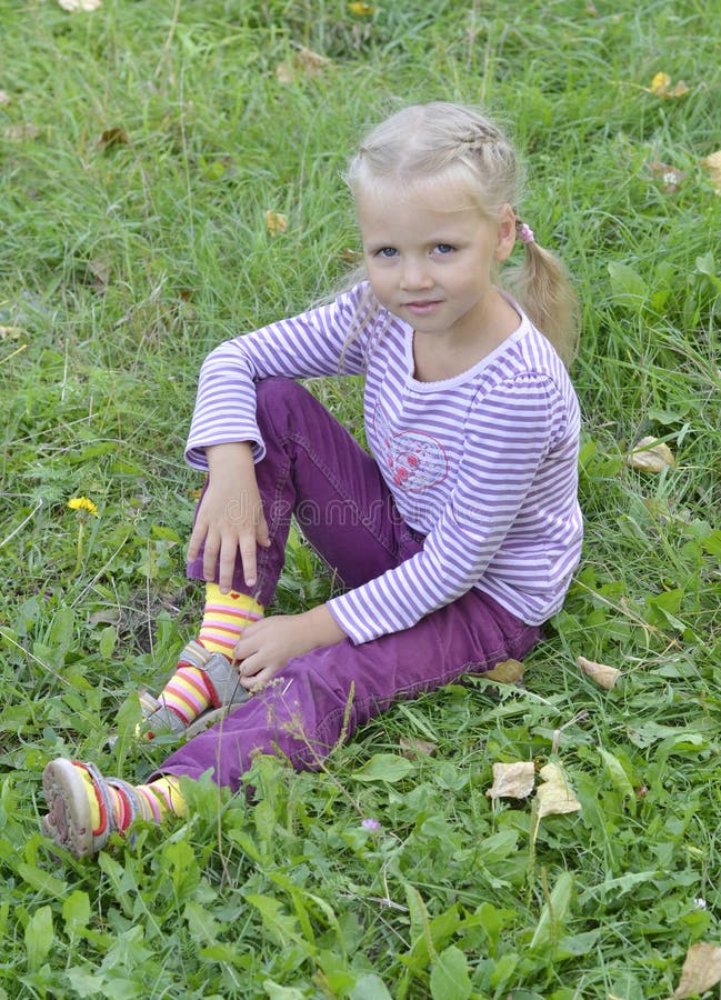 Child resting in the park stock photo. Image of grass - 26722156
