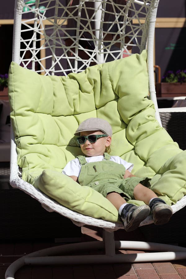 Child Resting in the Sun Lounger Stock Image - Image of idea, armchair ...