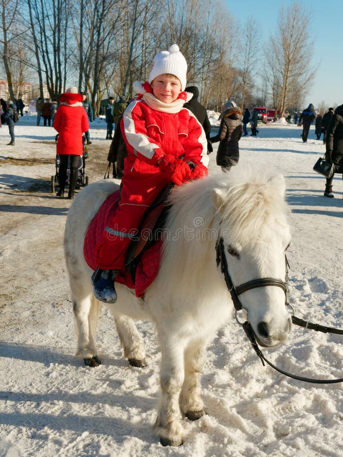 Child Riding a Pony Outside in Winter Stock Photo - Image of child ...