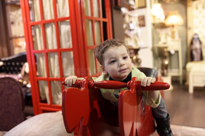 Child on a rocking horse stock photo. Image of beautiful - 38404940